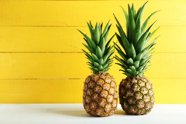Ripe pineapples on table - Stock Image - Everypixel