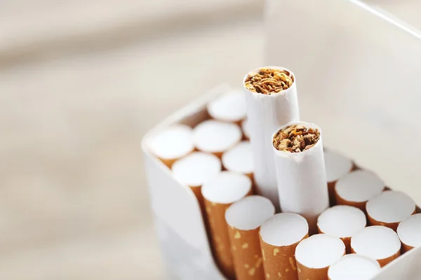 Open pack of cigarettes Stock Photo by ©5seconds 140869650