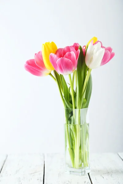Magenta tulips growing in water in a glass vase - bulbs and root ...