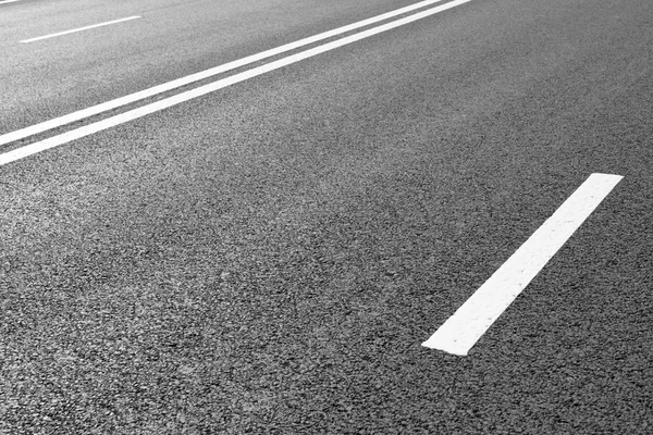 Asphalt road with marking lines white stripes - Stock Image - Everypixel
