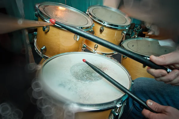 The drummer in action. A photo close up process play on a musical ...