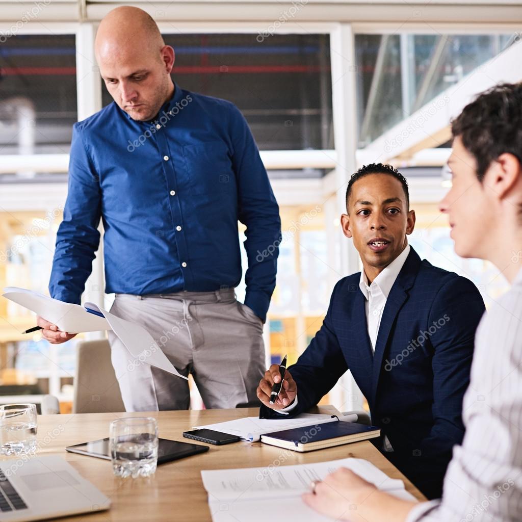 Three software developers meeting Stock Photo by ©NakoPhotography 120503532