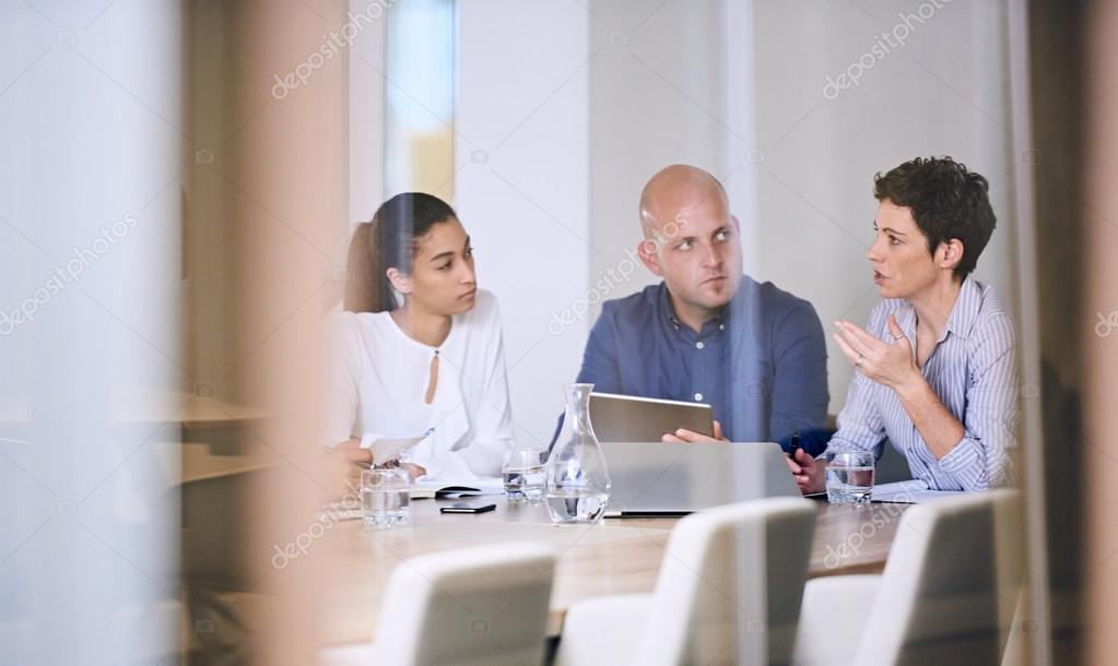 Business people in discussions in office — Stock Photo ...