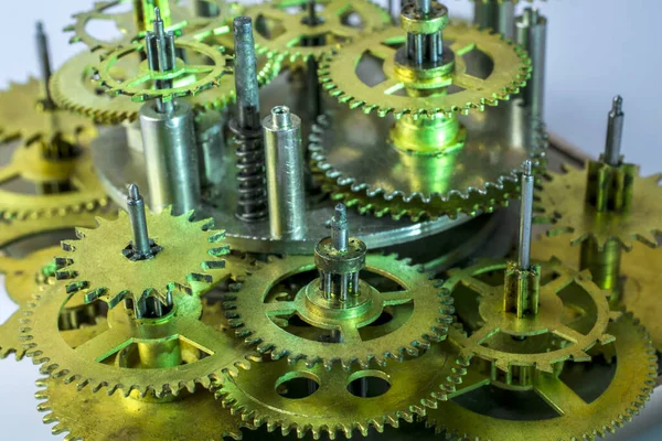 The broken mechanism of the old bronze gears from the clock close-up ...