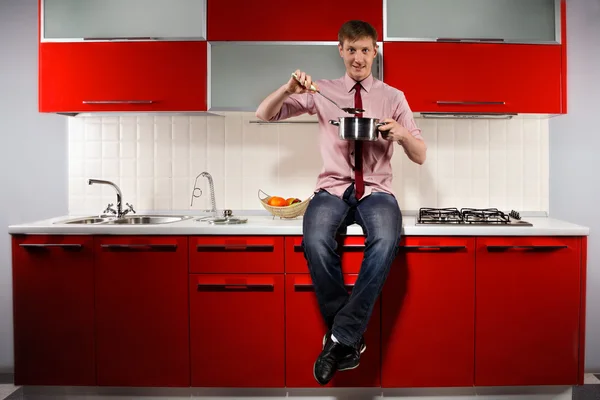 Hungry man in kitchen - Stock Image - Everypixel
