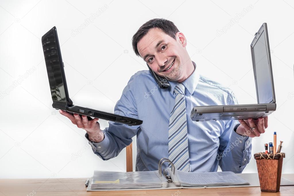Businessman holding laptops — Stock Photo © sureshot75 #70914487