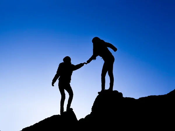 Two People Helping Each Other