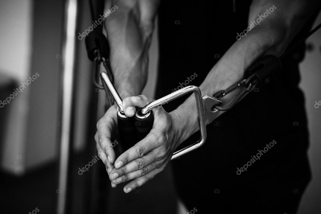 Bodybuilder guy in gym hands close up Stock Photo by ©shevtsovy 72227789