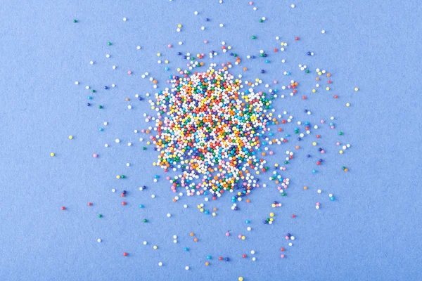 Colorful round sprinkles spilled on white background, isolated — Stock ...
