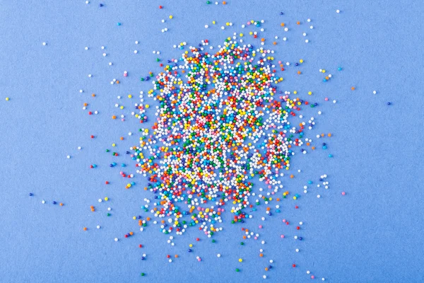 Colorful round sprinkles spilled on white background, isolated — Stock ...