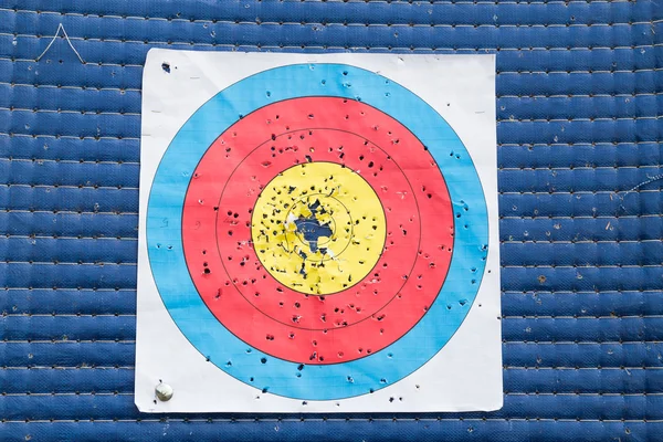Closeup on used and worn out outdoor archery target board - Stock Image ...