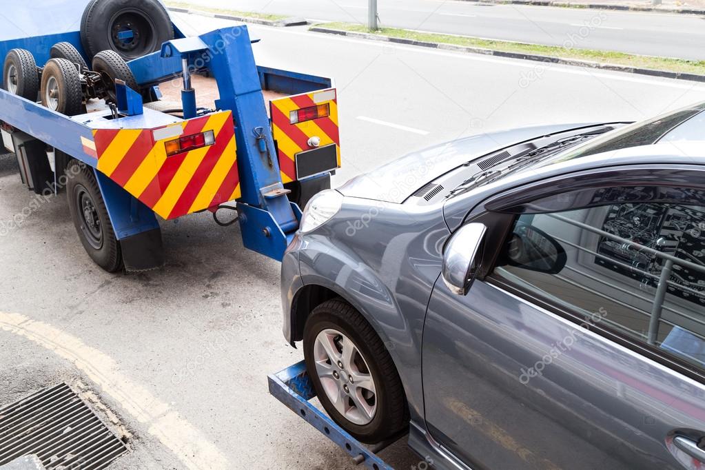 Tow truck towing a broken down car on the street Stock Photo by ©Thamkc ...