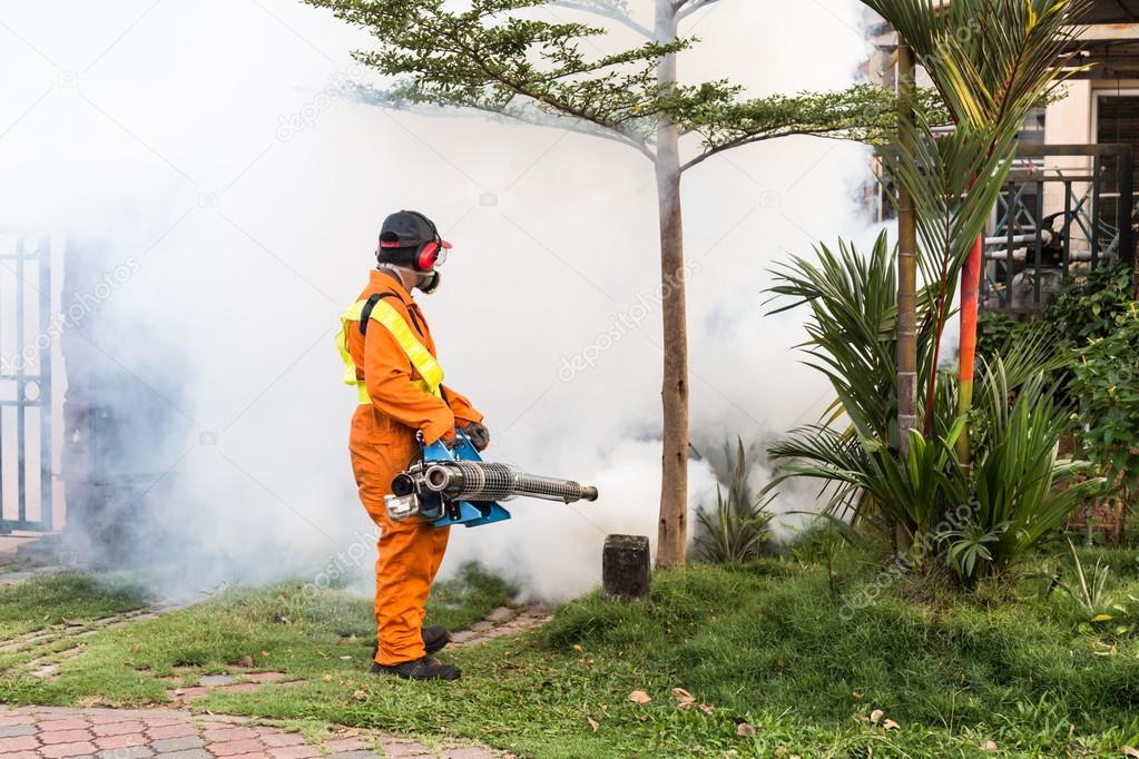 Worker fogging residential area with insecticides to kill aedes Stock ...