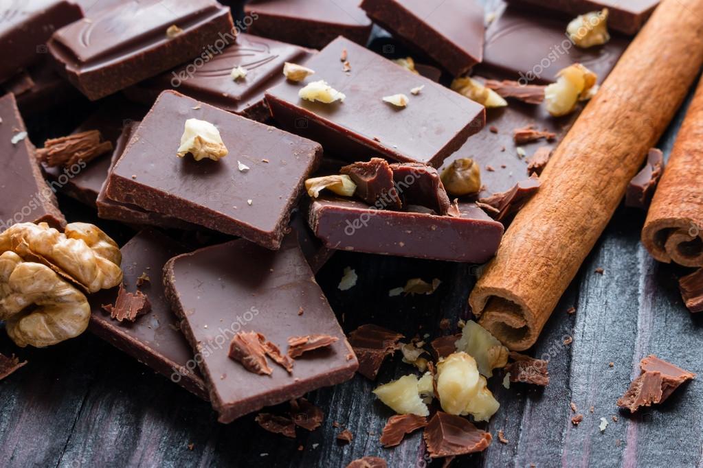 Broken chocolate with nuts and cinnamon ⬇ Stock Photo, Image by ...