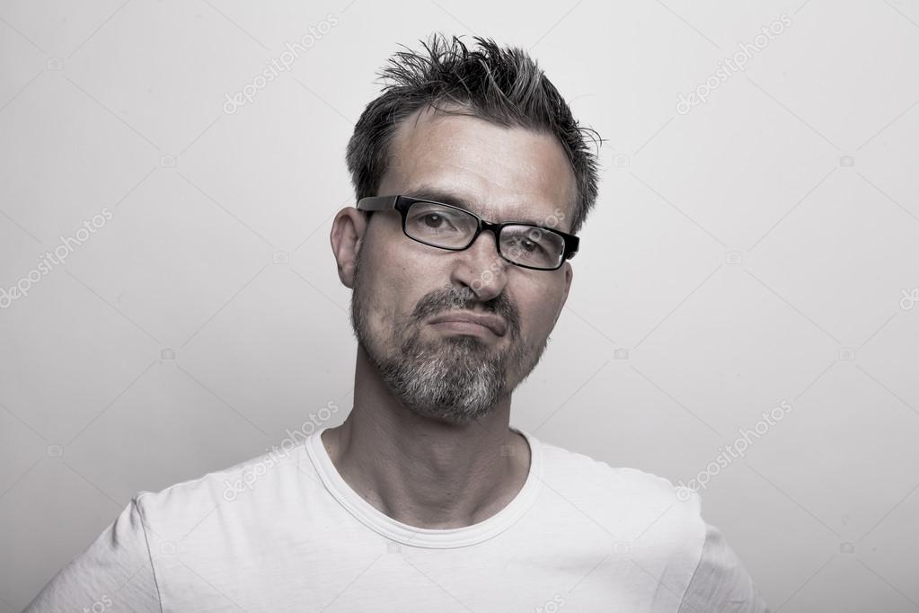 Slightly annoyed man Stock Photo by ©vizualni 79961660
