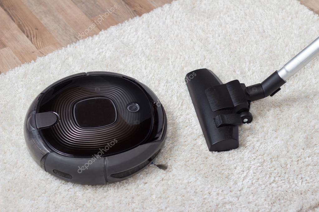 Traditional vacuum cleaner versus a modern one — Stock Photo © digender ...