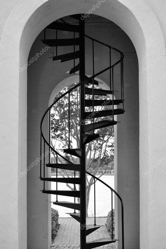 Black and white photo of tall metal stairs in a clock tower stairwell ...