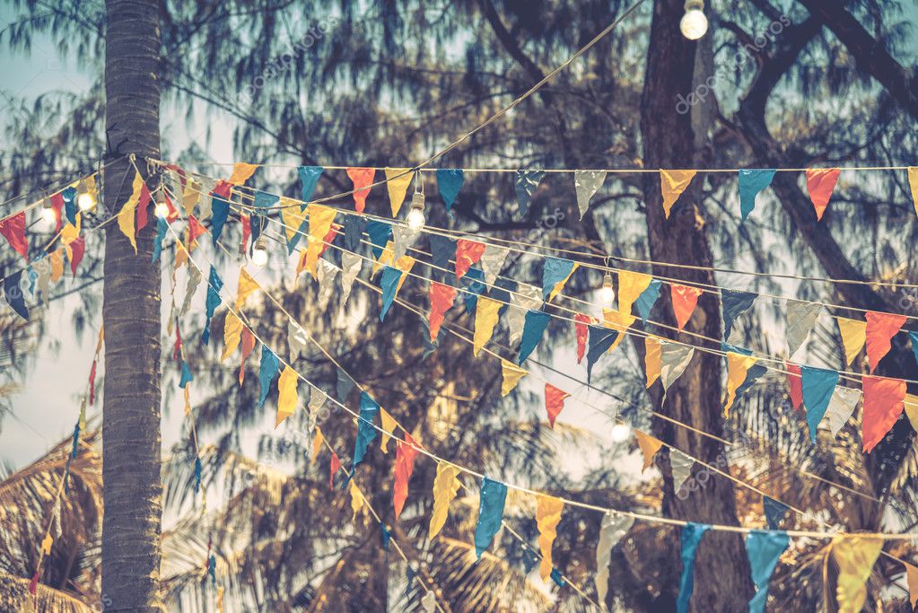 Decorative triangular flags and lamps on trees — Stock Photo © mladich ...