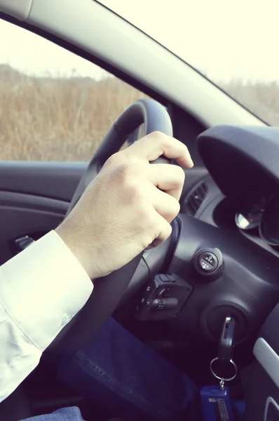 The driver behind the wheel of a car - Stock Image - Everypixel