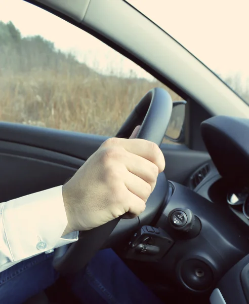 The driver behind the wheel of a car - Stock Image - Everypixel