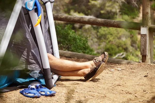 Legs lying in tourist tent - Stock Image - Everypixel
