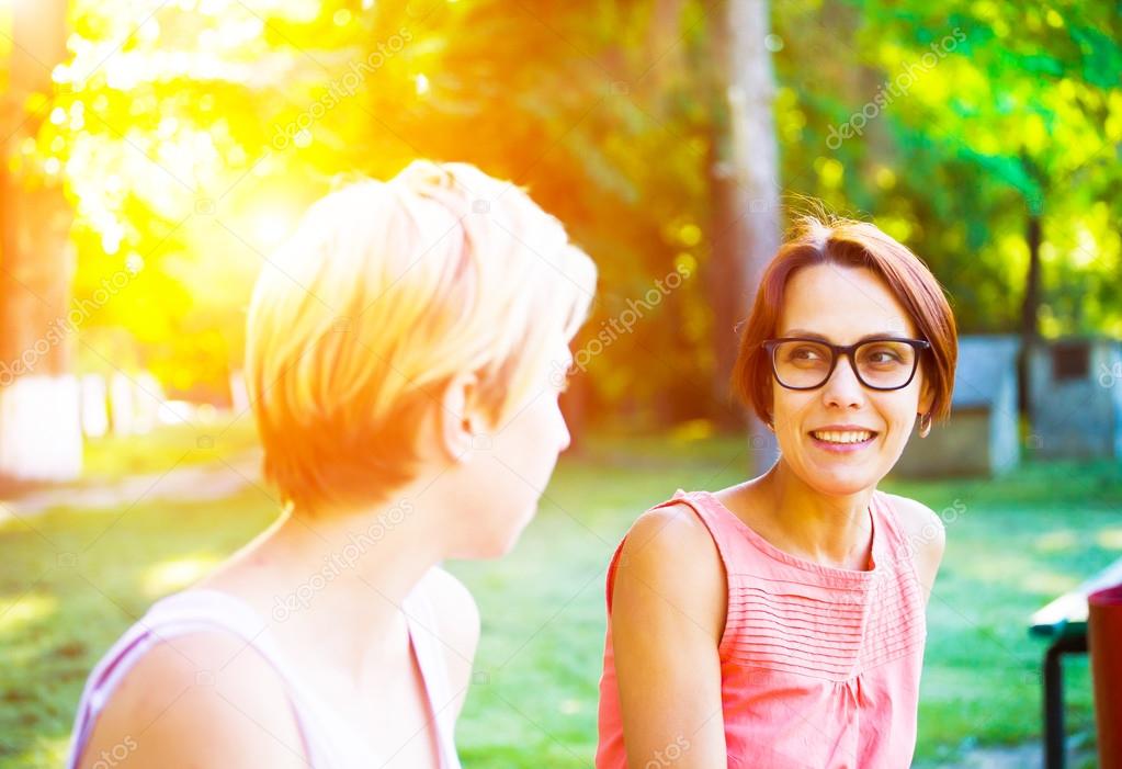 Two girls having fun in the Park. Stock Photo by ©zhukovvvlad 117600752