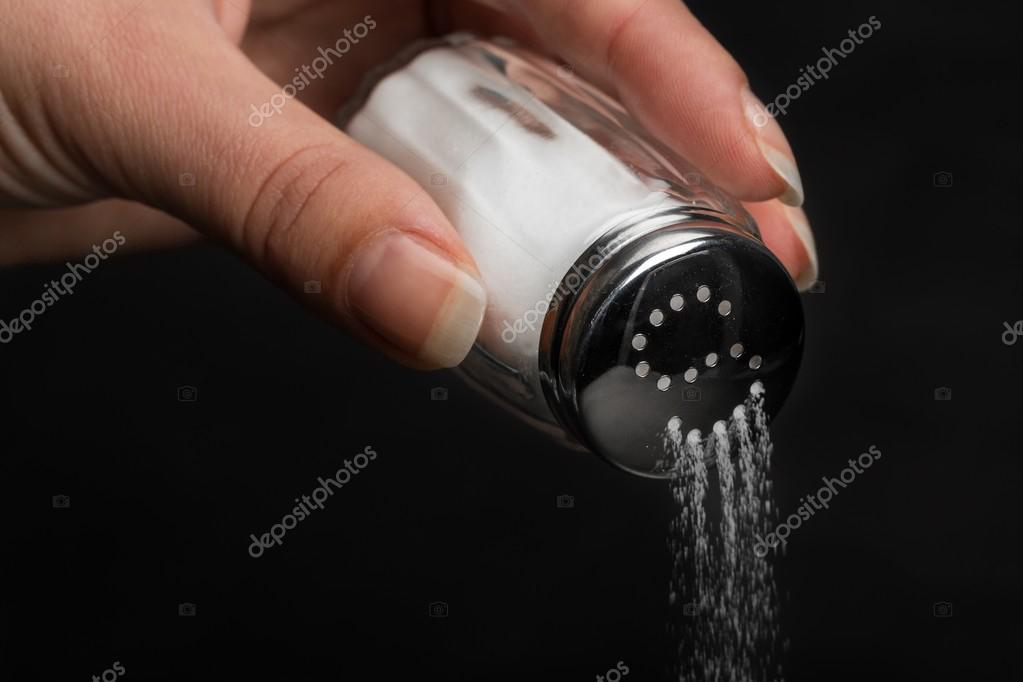 Female hand with salt shaker — Stock Photo © billiondigital #114720044