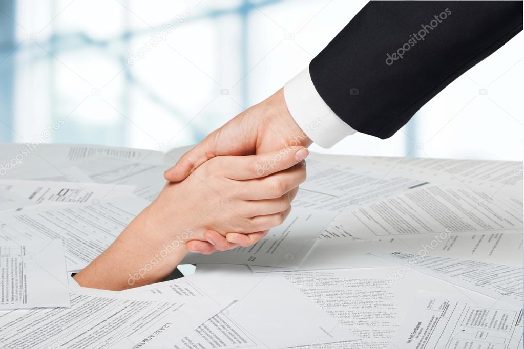 Businesswoman hand in stack of papers — Stock Photo © billiondigital ...
