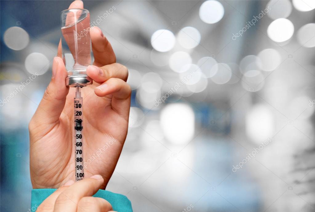 Human Hand with injection Syringe — Stock Photo © billiondigital #118567304