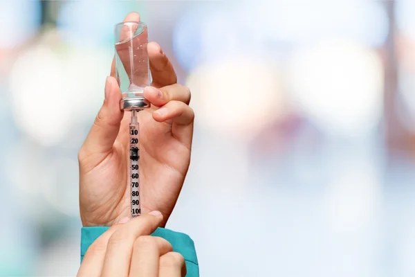 Human Hand with injection Syringe — Stock Photo © billiondigital #118567304