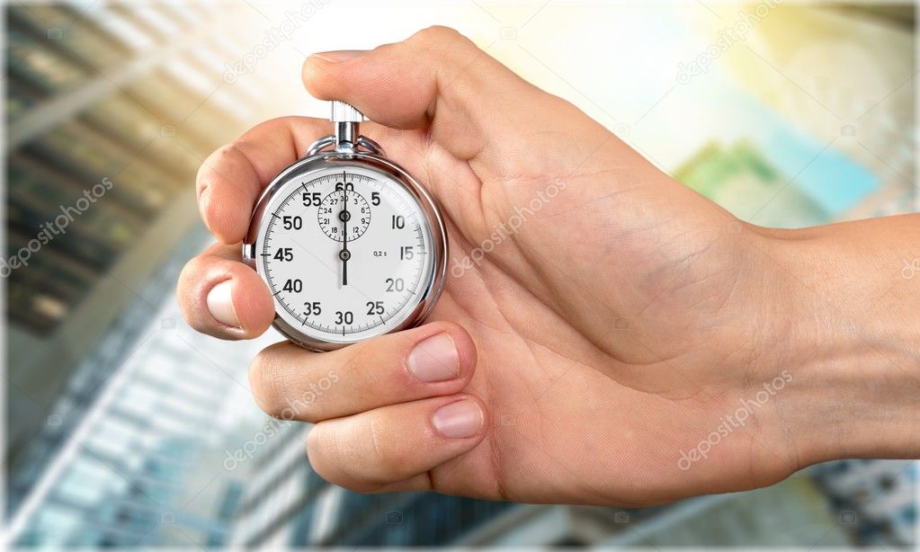 Stopwatch in Human Hand Stock Photo by ©billiondigital 118622376