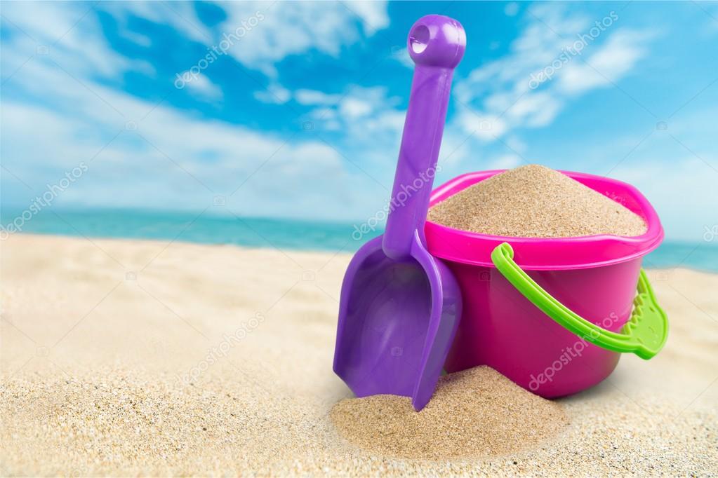 Beach with a spade and bucket Stock Photo by ©billiondigital 118717856