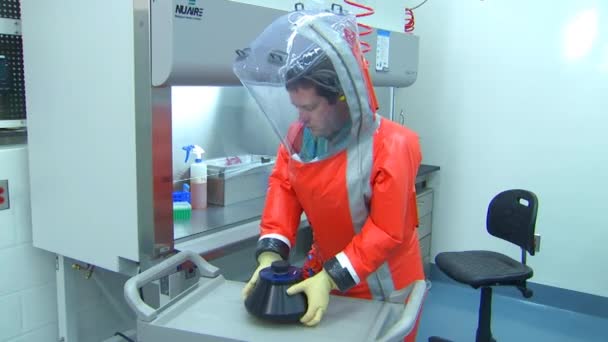 Scientist wear biohazard suit to study viruses — Stock Video © rickray ...