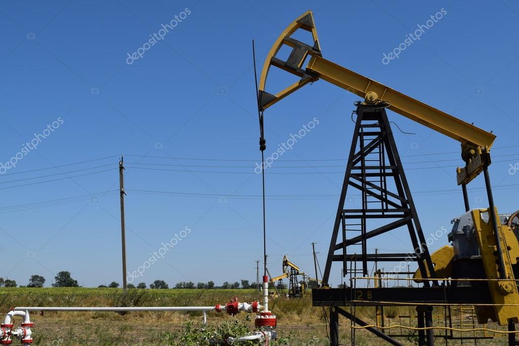 Pumping unit as the oil pump installed on a well — Stock Photo © Leonid ...