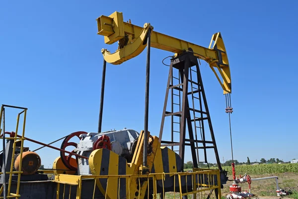 Pumping unit as the oil pump installed on a well — Stock Photo © Leonid ...