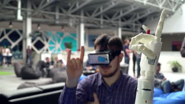 Cybernetic robot arm, which controls the people. Man controls robotic ...