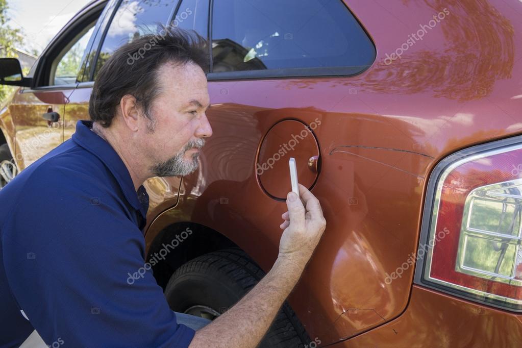 Adjuster Taking Photos Of Damage — Stock Photo © IndyEdge #86682274