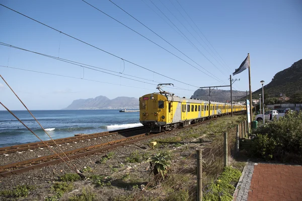 Costal line passenger train passing Kalk Bay in the Western cape South ...