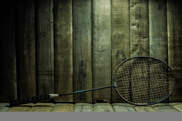Badminton Rackets and Birdie on the Wooden Wall Stock Photo by ...