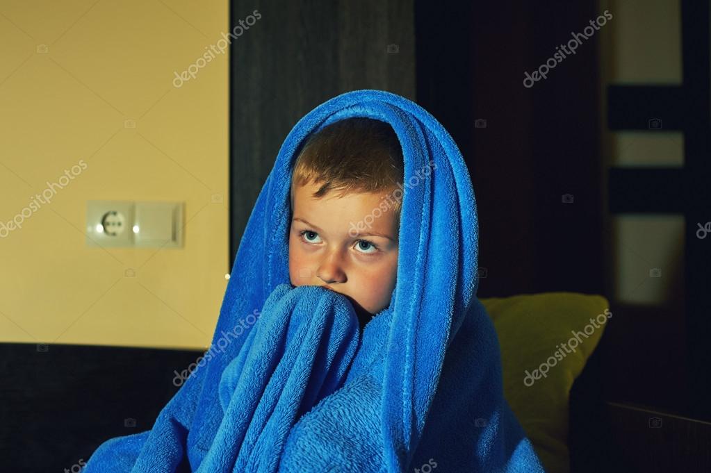 A scared little boy afraid in bed at night , childhood fears Stock ...
