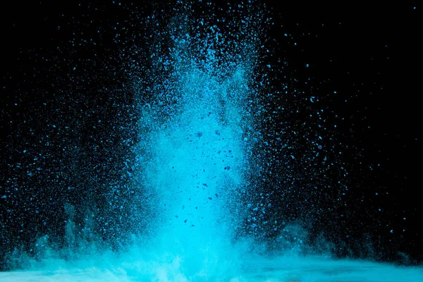 Explosion of blue powder on black background - Stock Image - Everypixel