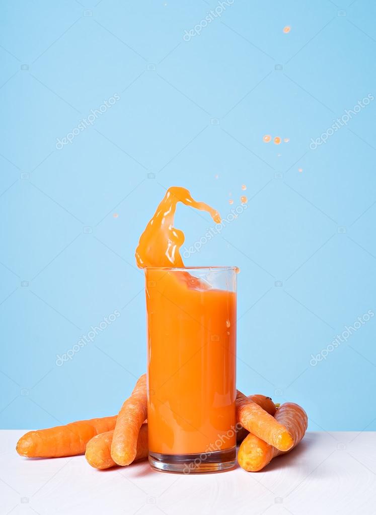 Colorful fresh carrot juice splash in glass Stock Photo by ©christina ...