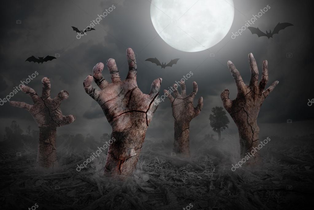 Zombie hand rising out of the ground — Stock Photo © nednapa #66497245