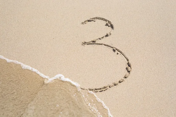 The numbers three written in the sand. Stock Photo by ©Satura_ 111417558