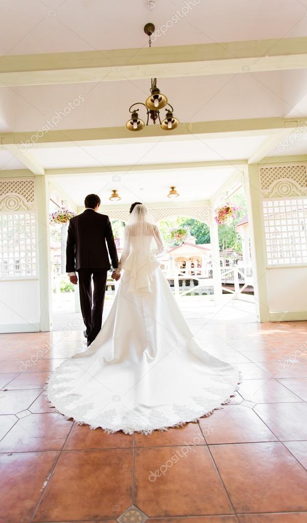 Back view of holding hands bride and groom — Stock Photo © Satura ...