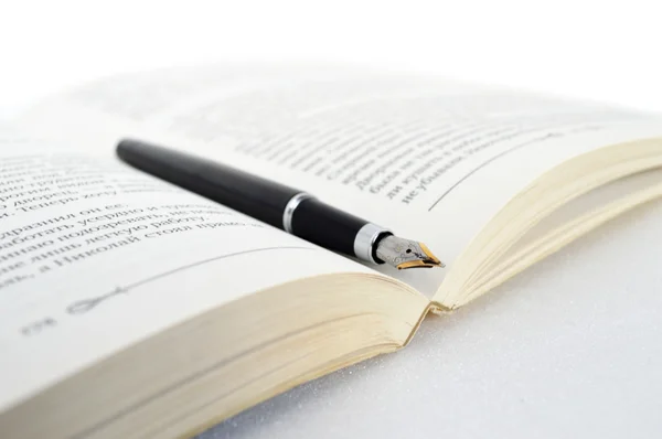 Fountain pen on a book — Stock Photo © minervastock #35658273