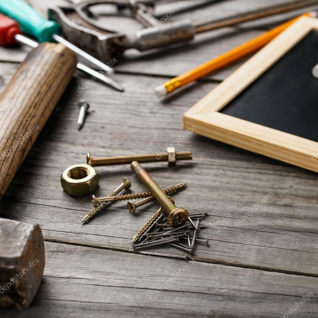 Old building tools on a wooden table Stock Photo by ©KucherAndrey 112534802