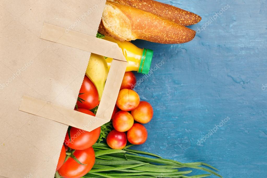 Full paper bag with different food Stock Photo by ©KucherAndrey 119294070