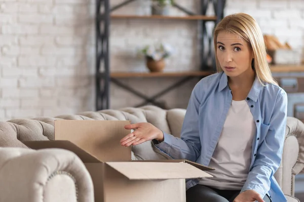 An unhappy customer opened a cardboard package and was upset about the ...