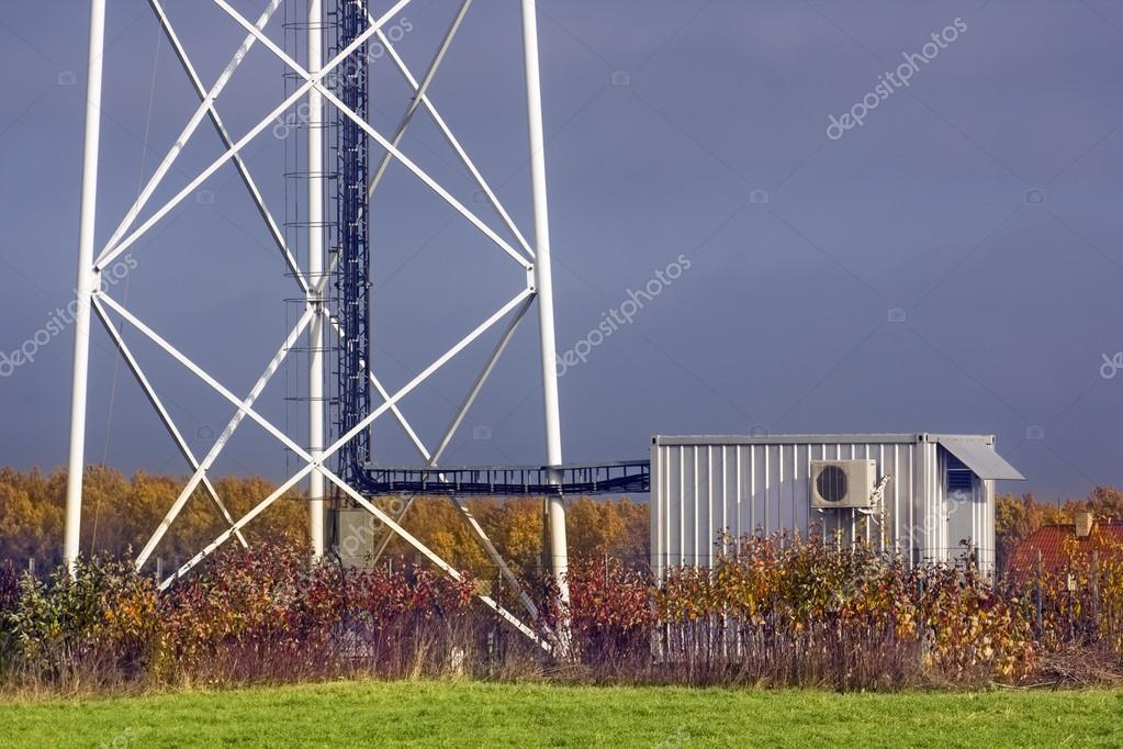 Metallic telecommunications tower's control building — Stock Photo ...